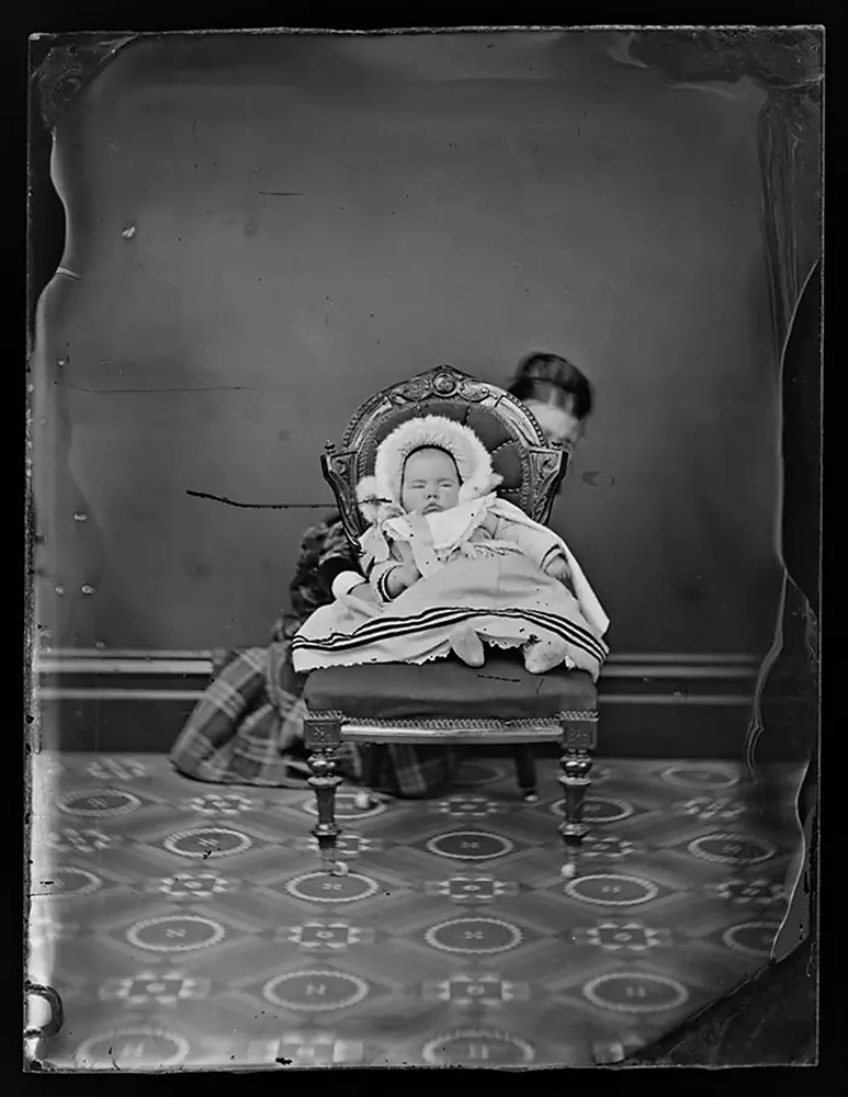 William James Harding Young woman looking at photograph albumArt Blart ...